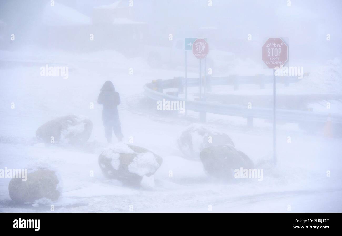 A pedestrian leaves the Iqaluit Airport as a winter storm hits Iqaluit ...