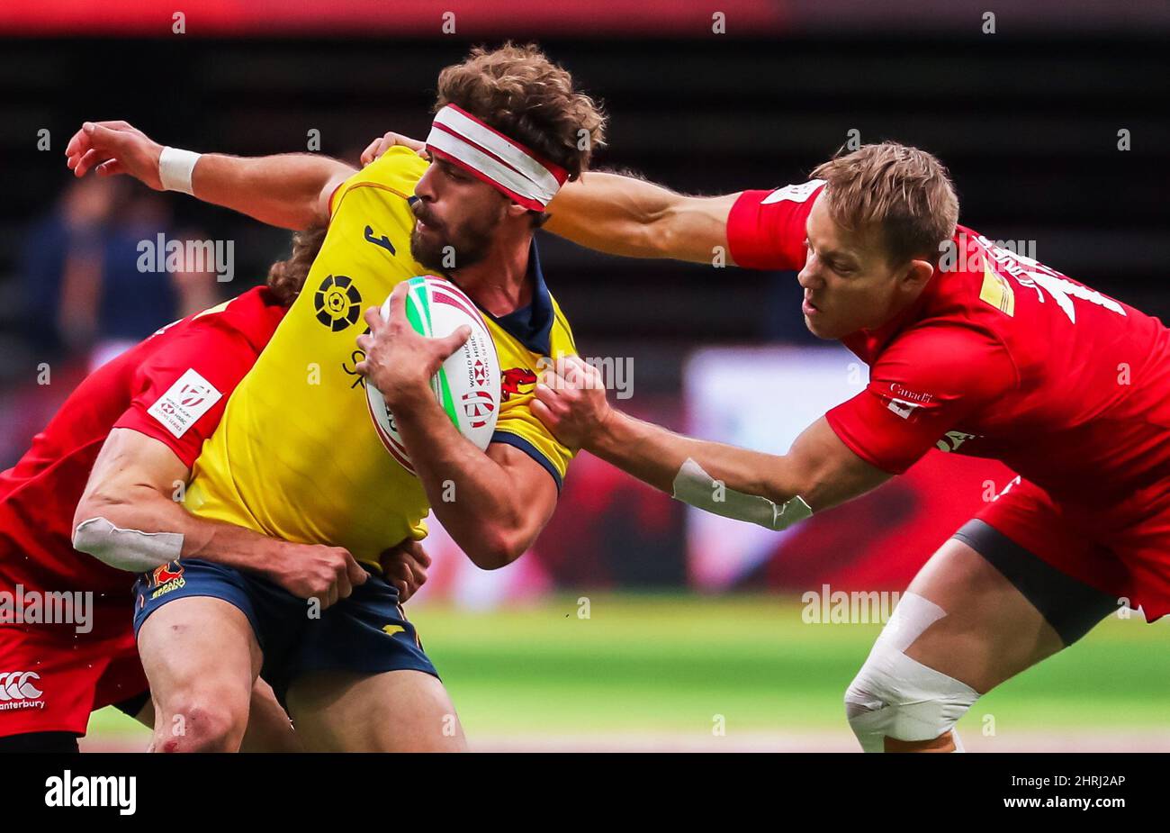 Canada's Luke McCloskey (5) and Harry Jones (11) tackle Spain's Manuel ...