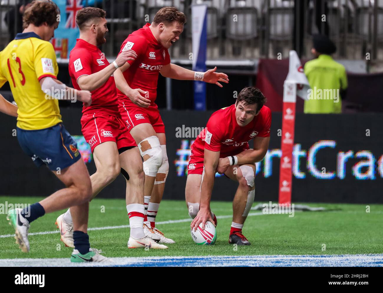 Canada's Matt Mullins (1) scores a try against Spain with teammates ...