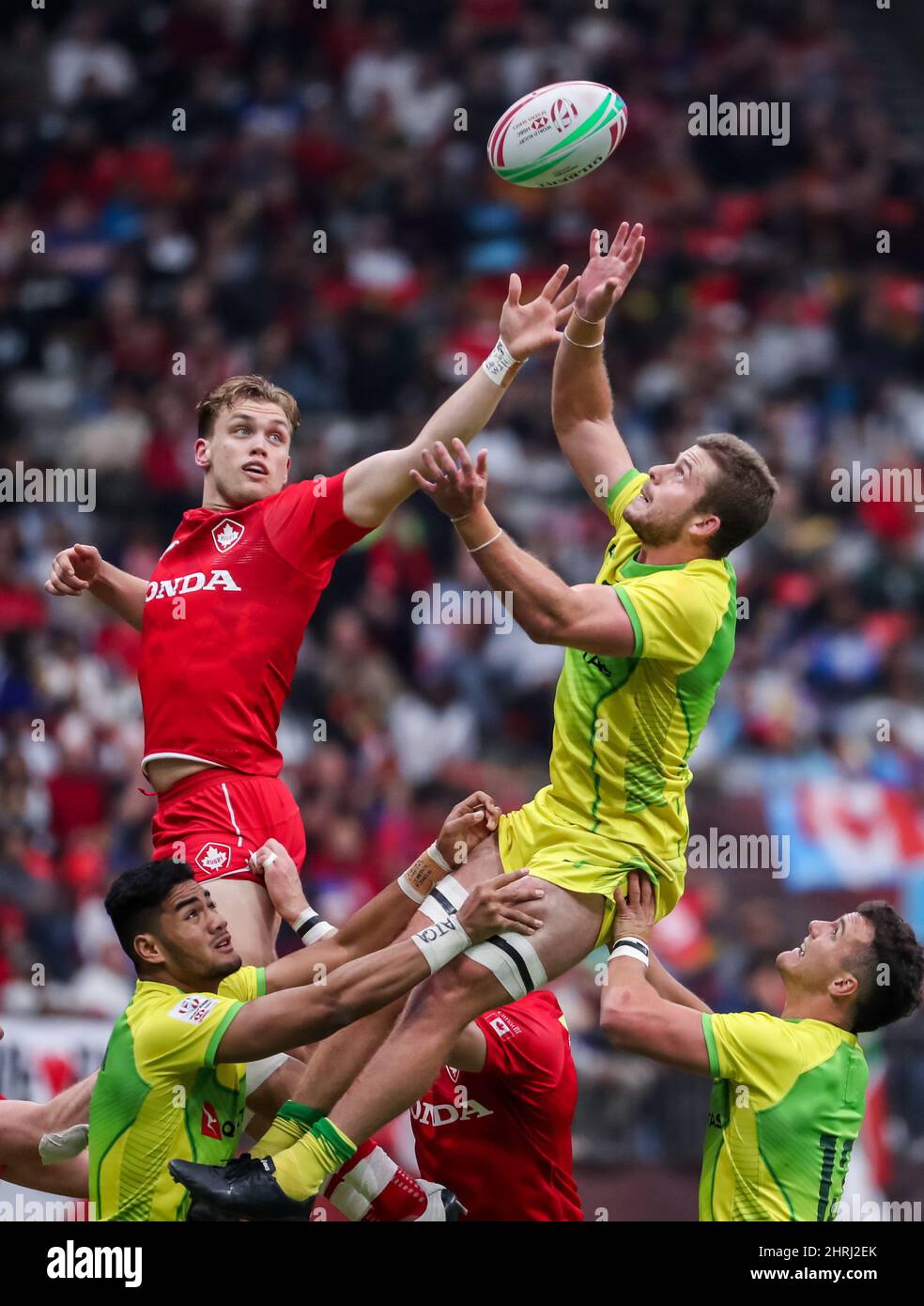 Canada's Jake Thiel (left) jumps for the ball against Australia's Nick ...