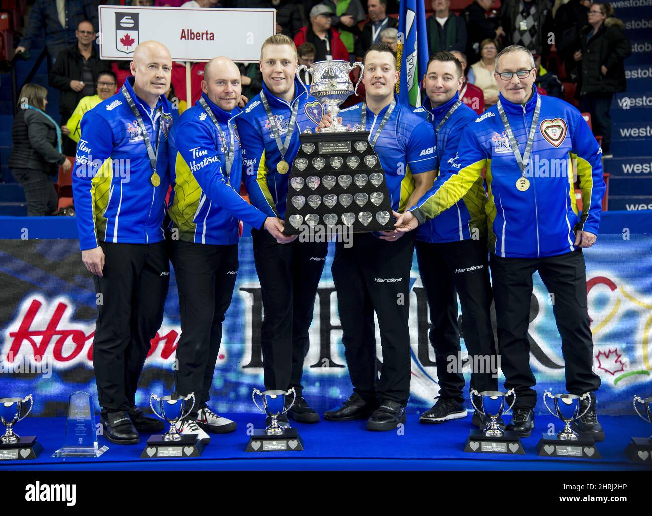 Team Alberta skip Kevin Koe (left to right), third B.J. Neufeld, second ...