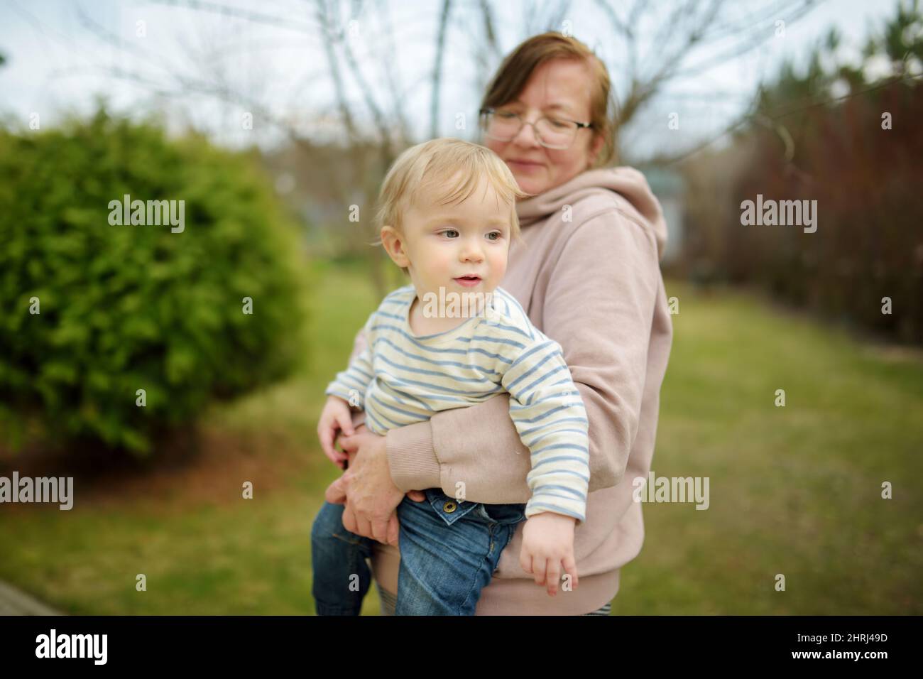 Grandmother taking care grandchild hi-res stock photography and images ...