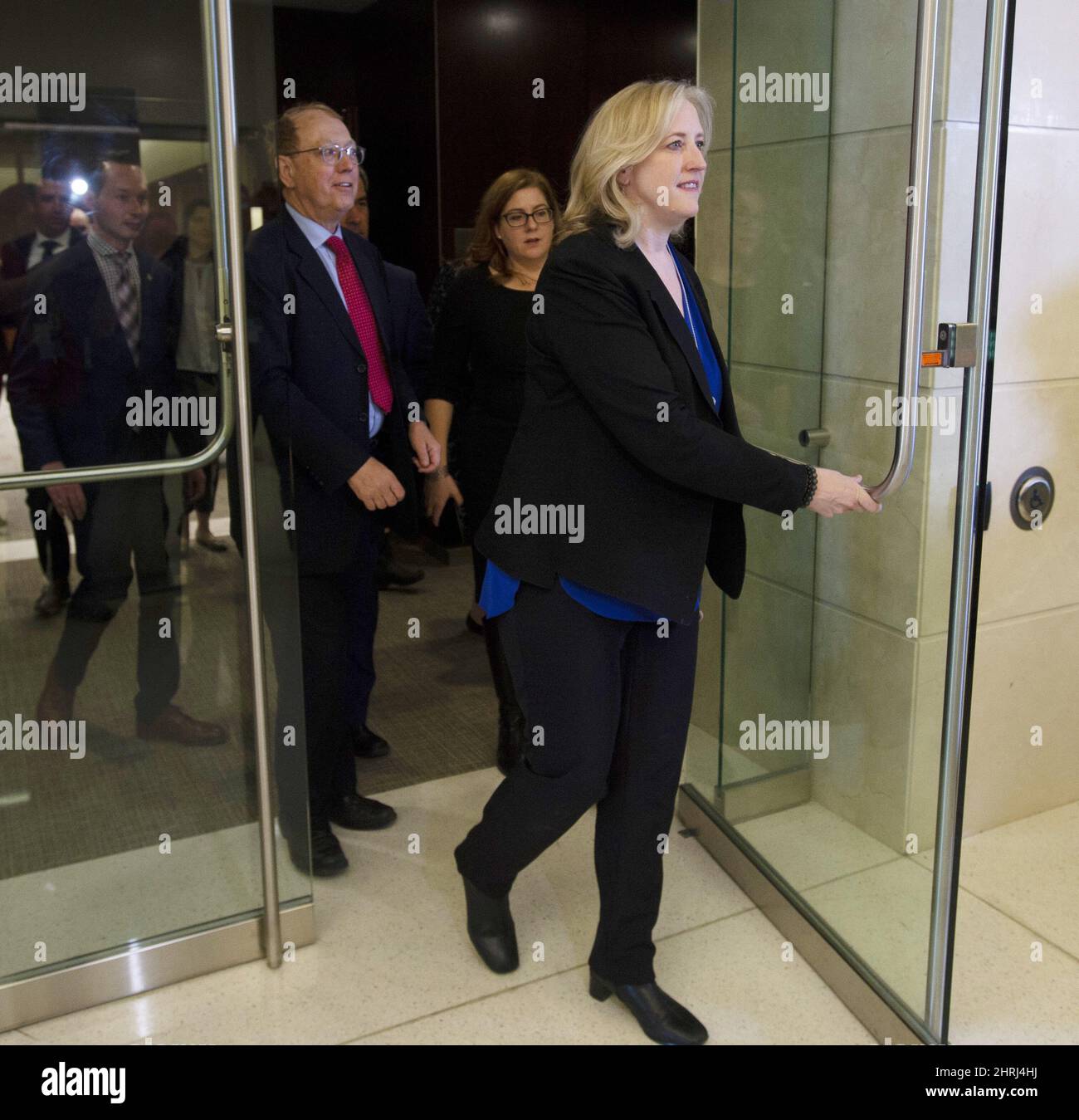 Conservative MP Lisa Raitt and NDP MP Murray Rankin lead a group out of ...
