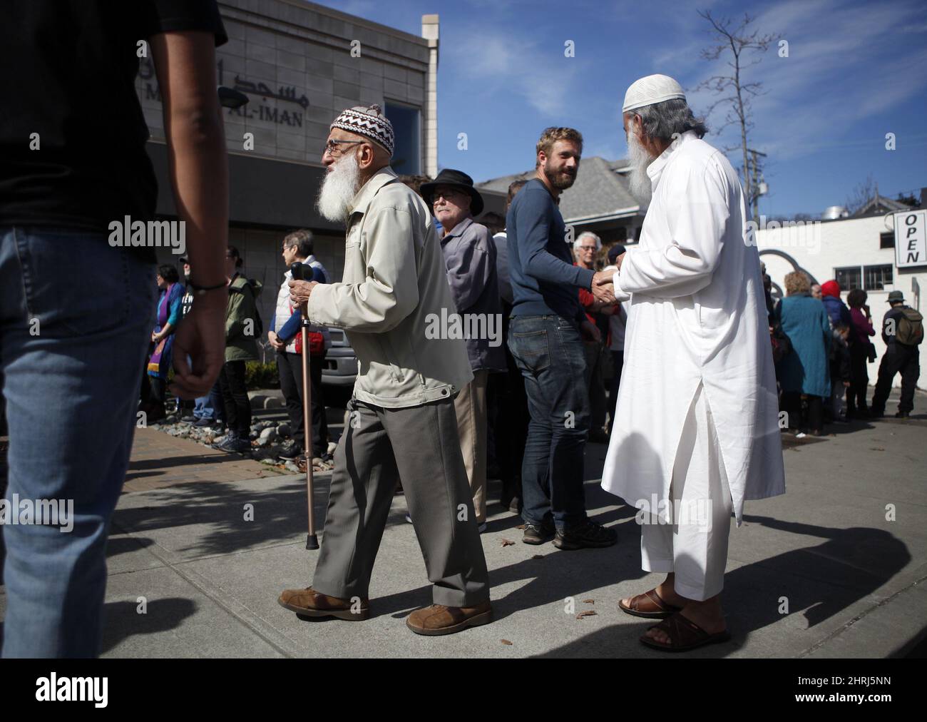 People gather with the Sikh Youth of Victoria during a protective human ...