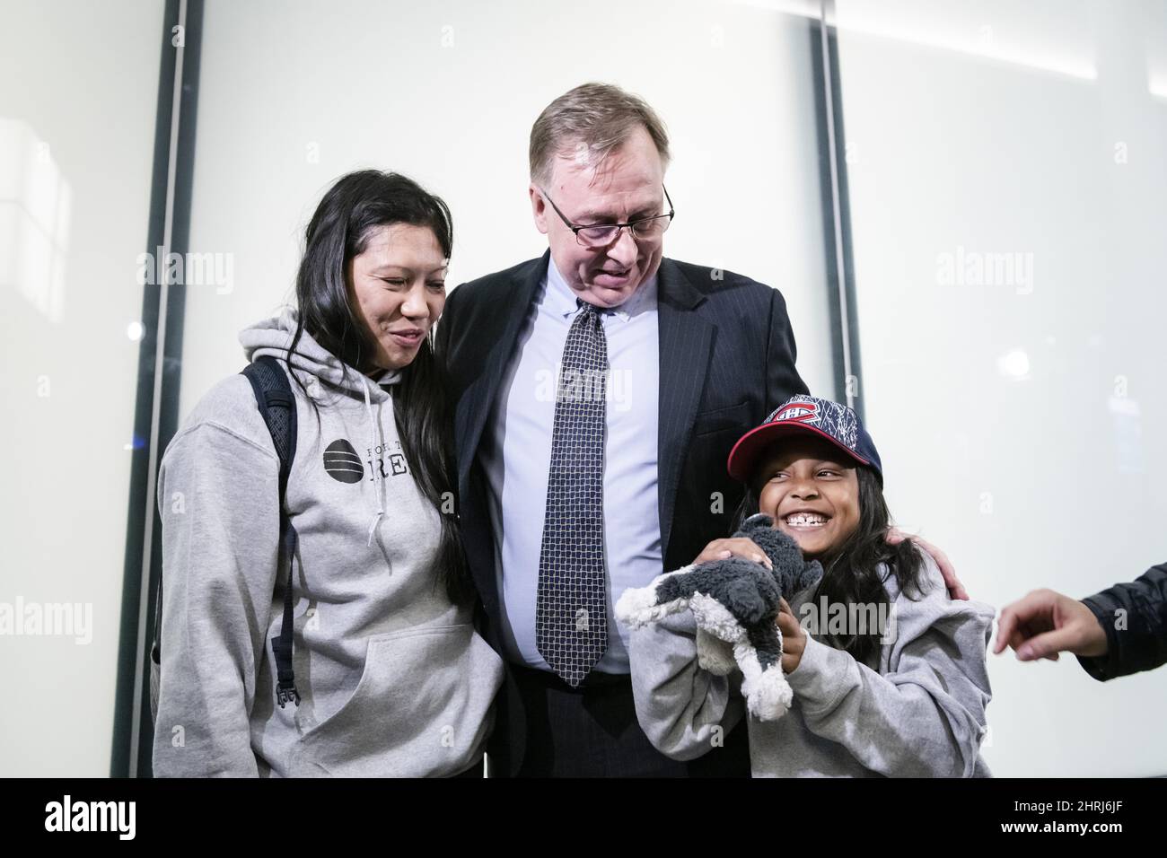 Vanessa Rodel and her seven-year-old daughter Keana hug lawyer Robert ...