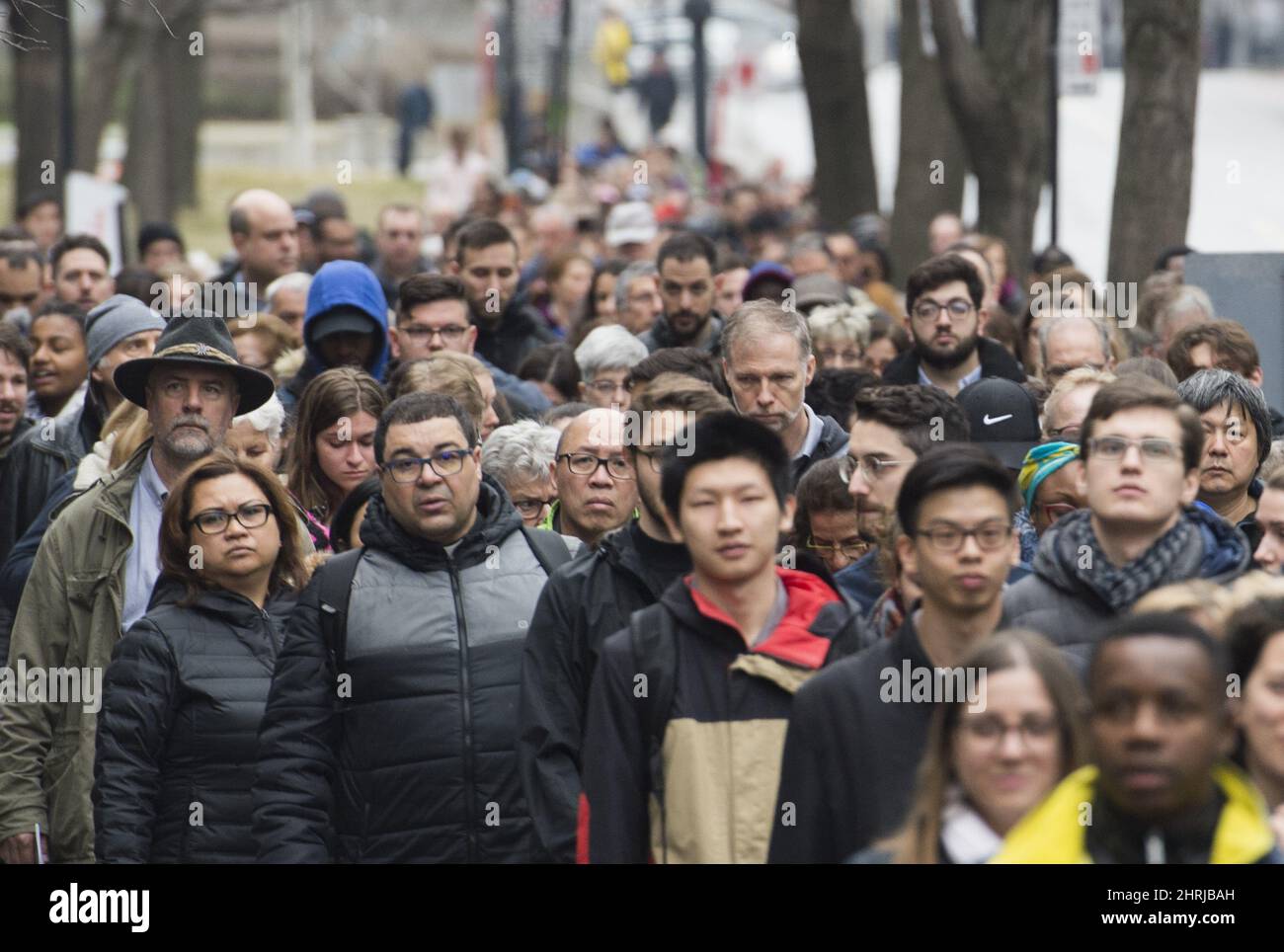 The faithful walk along a street during the Stations of the Cross in ...