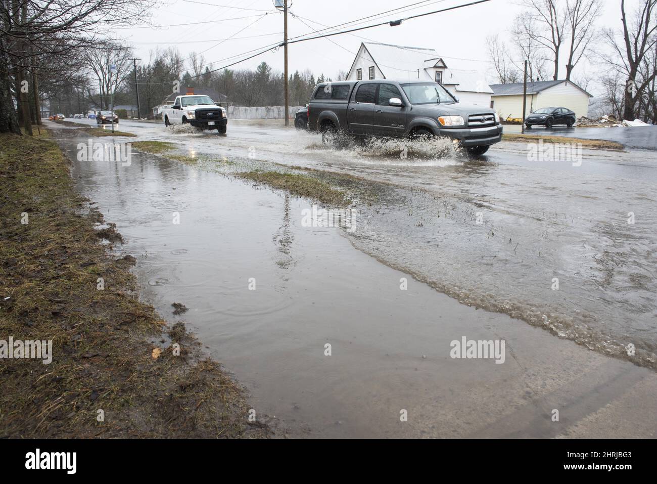 Streets and sidewalks are flooded from heavy rain and flood water from ...