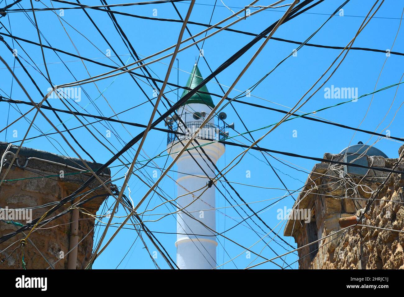 Power lines, a messy mess of power lines between houses in the ancient ...