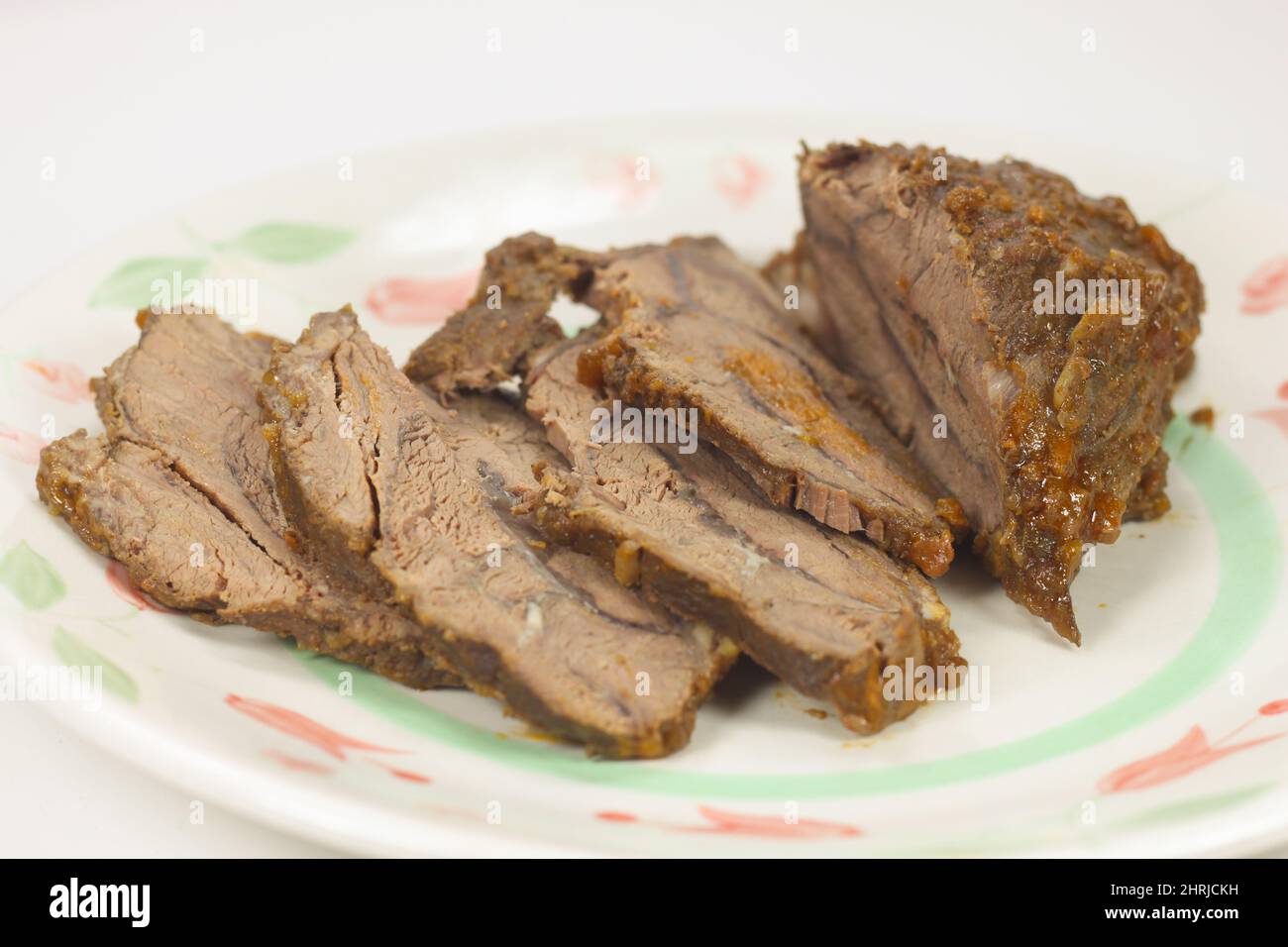 Pork meat cheek dish made with red wine Stock Photo - Alamy