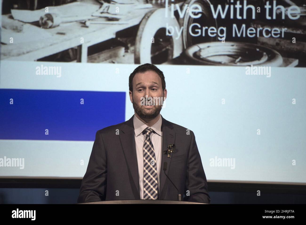 Greg Mercer, of the Waterloo Region Record, accepts the award for Local ...