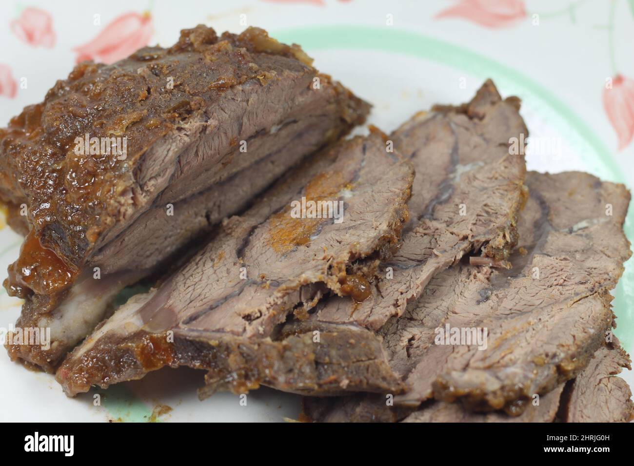 Meat pork cheek dish made with red wine Stock Photo - Alamy