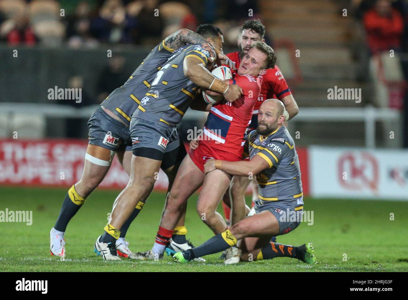 Jez Litten #14 of Hull KR is stopped by the Castleford defence Stock ...