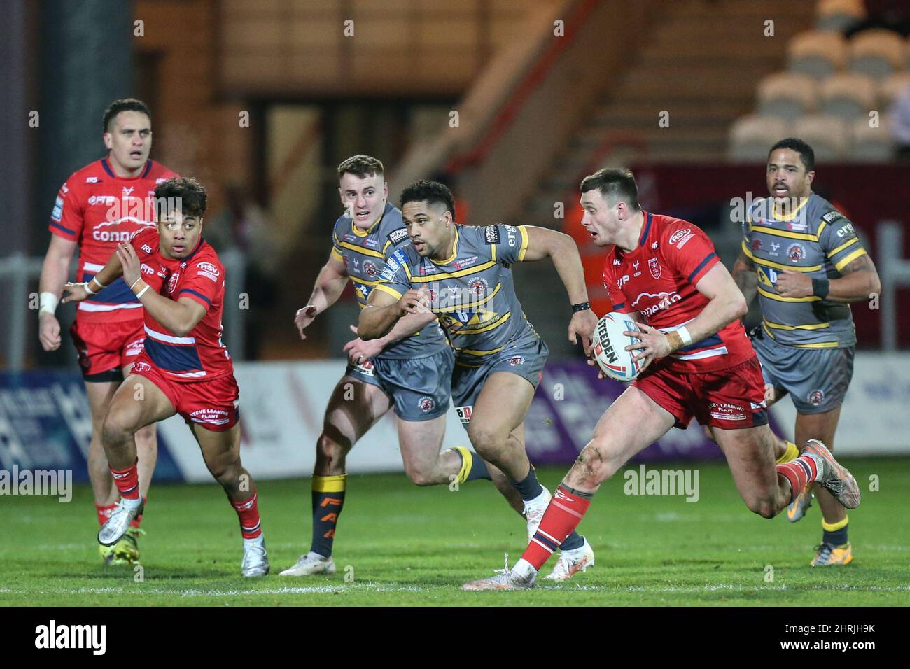 Sam Wood #24 of Hull KR looks to pass to Phoenix Laulu-Togaga'e #29 of ...