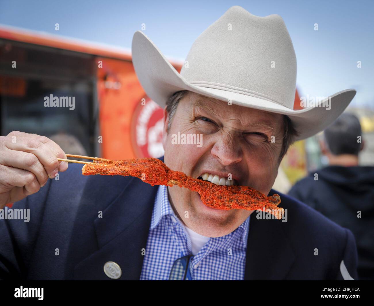 James Radke, manager of midway operations, samples "Flaming Hot Cheetos ...