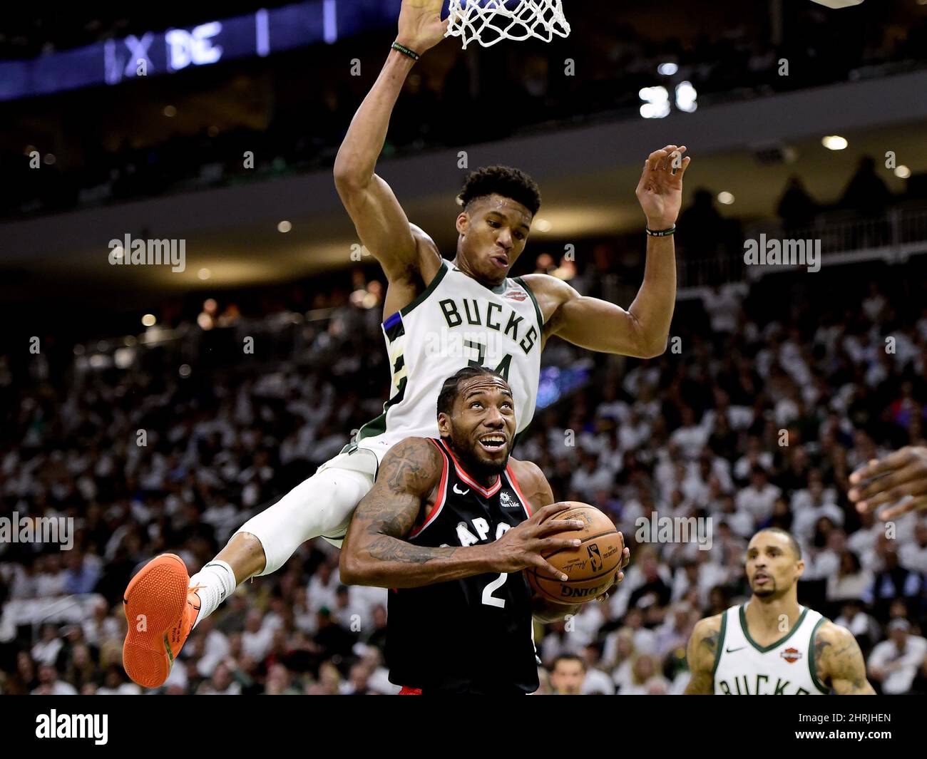 Toronto Raptors forward Kawhi Leonard (2) gets fouled by Milwaukee Bucks forward Giannis ...