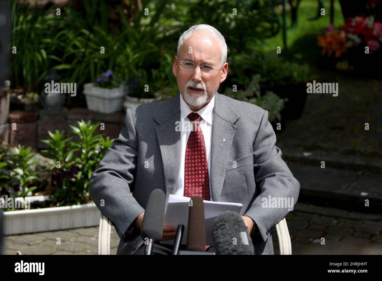 Suspended Sgt-at-arms Gary Lenz gives an interview from his backyard ...