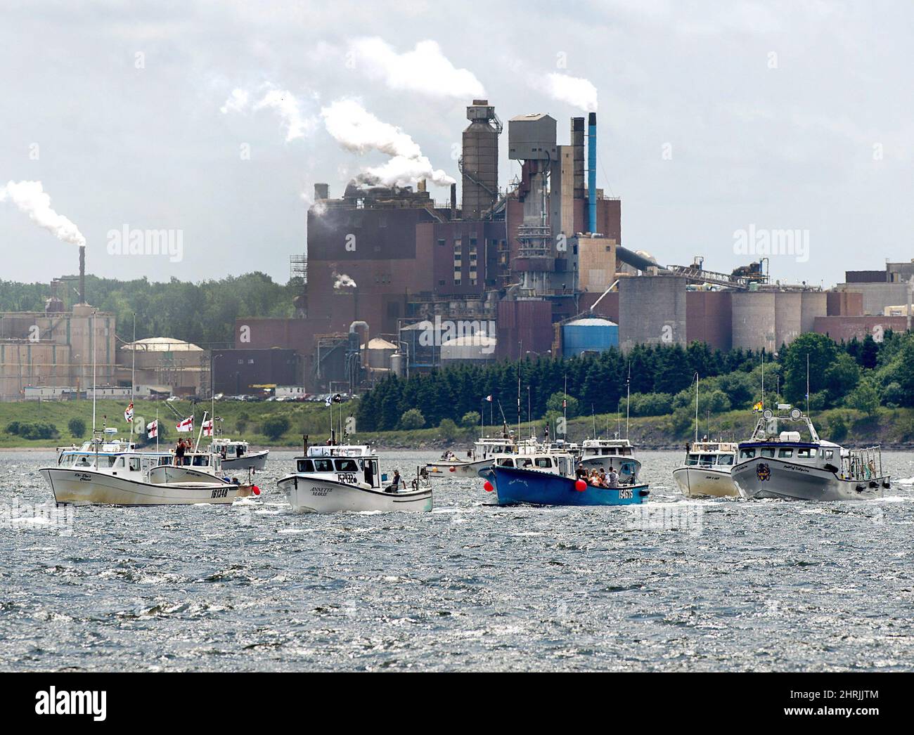 Fishing boats pass the Northern Pulp mill as concerned residents ...