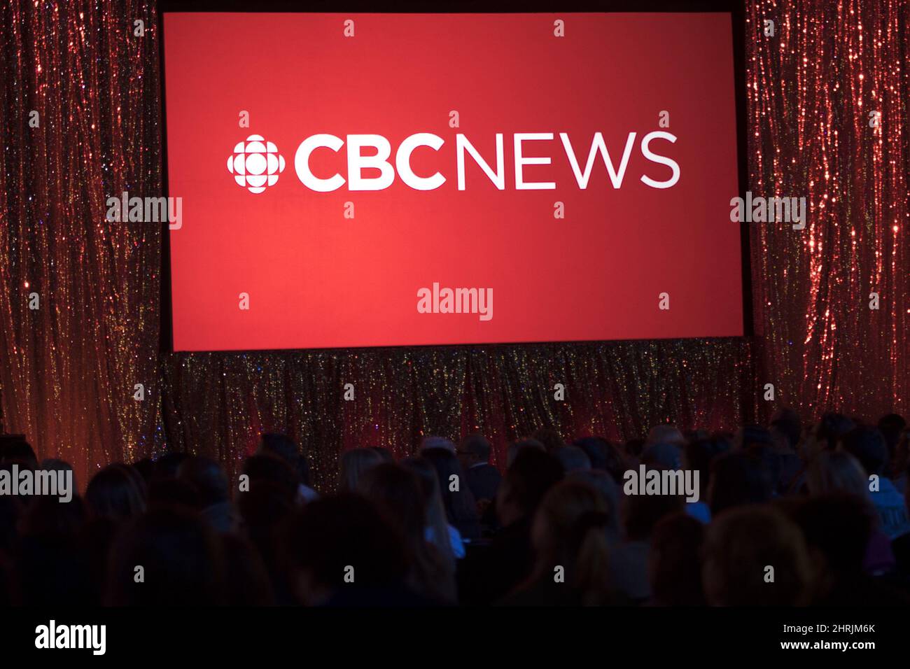 The CBC News logo is projected onto a screen during the CBC's annual ...
