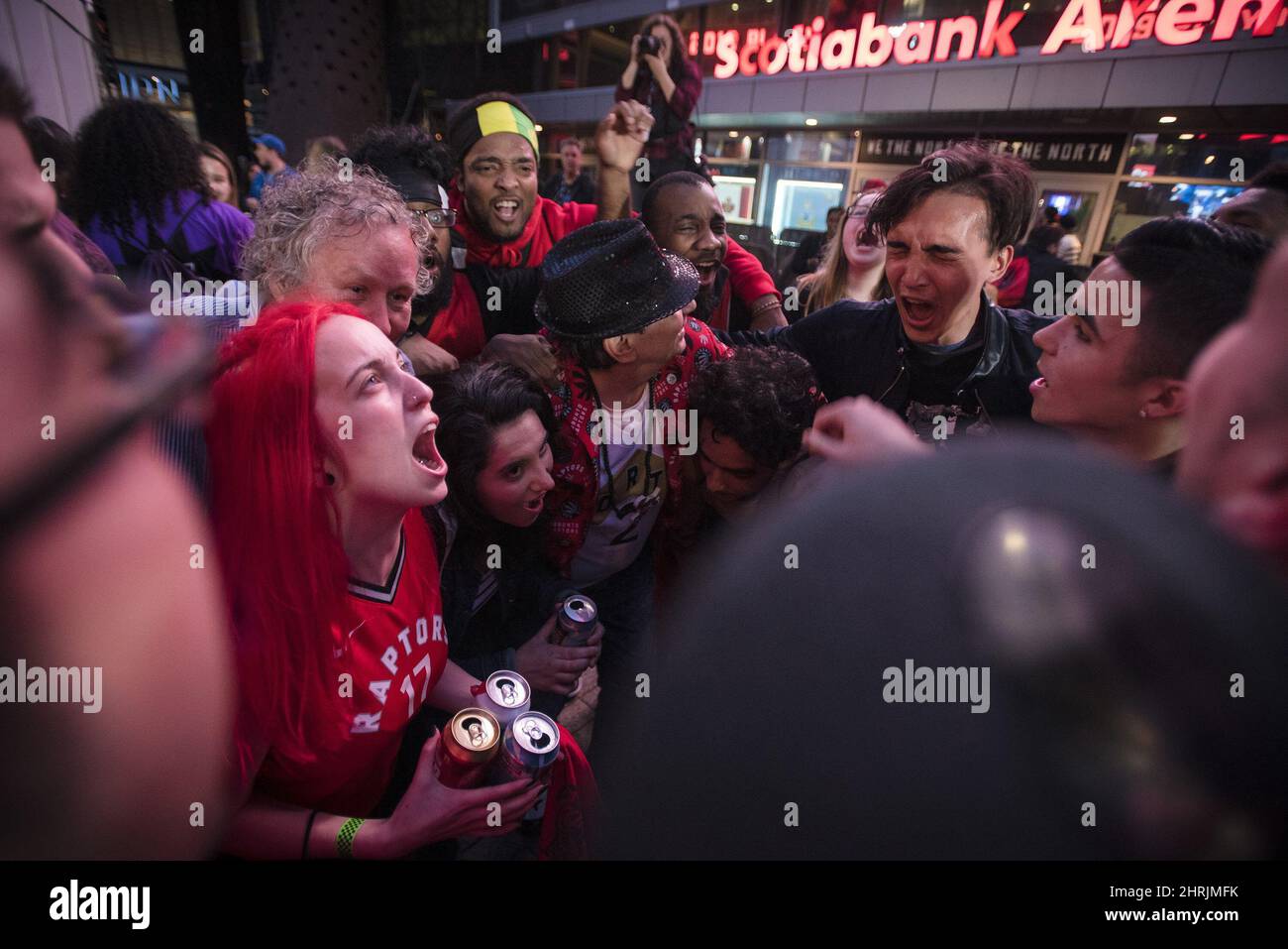Toronto Raptors fans huddle outside the Scotiabank Arena, at what's ...