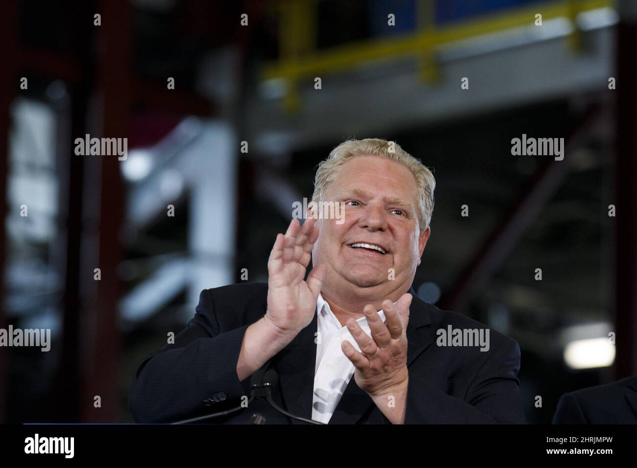 Ontario Premier Doug Ford applauds during an announcement in the the ...