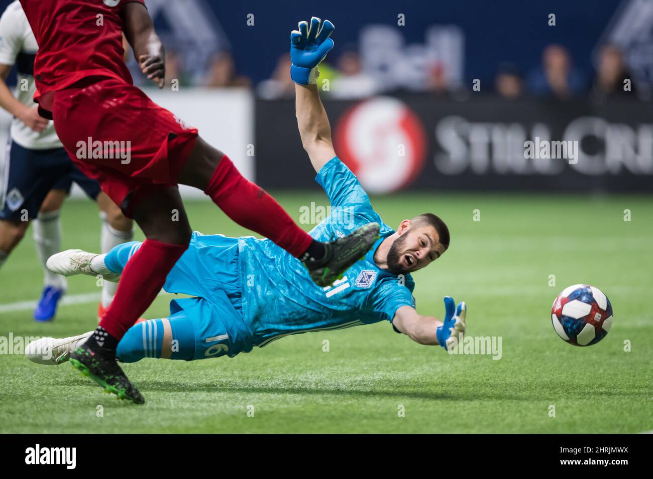 Vancouver Whitecaps goalkeeper Maxime Crepeau, back, allows a goal to ...