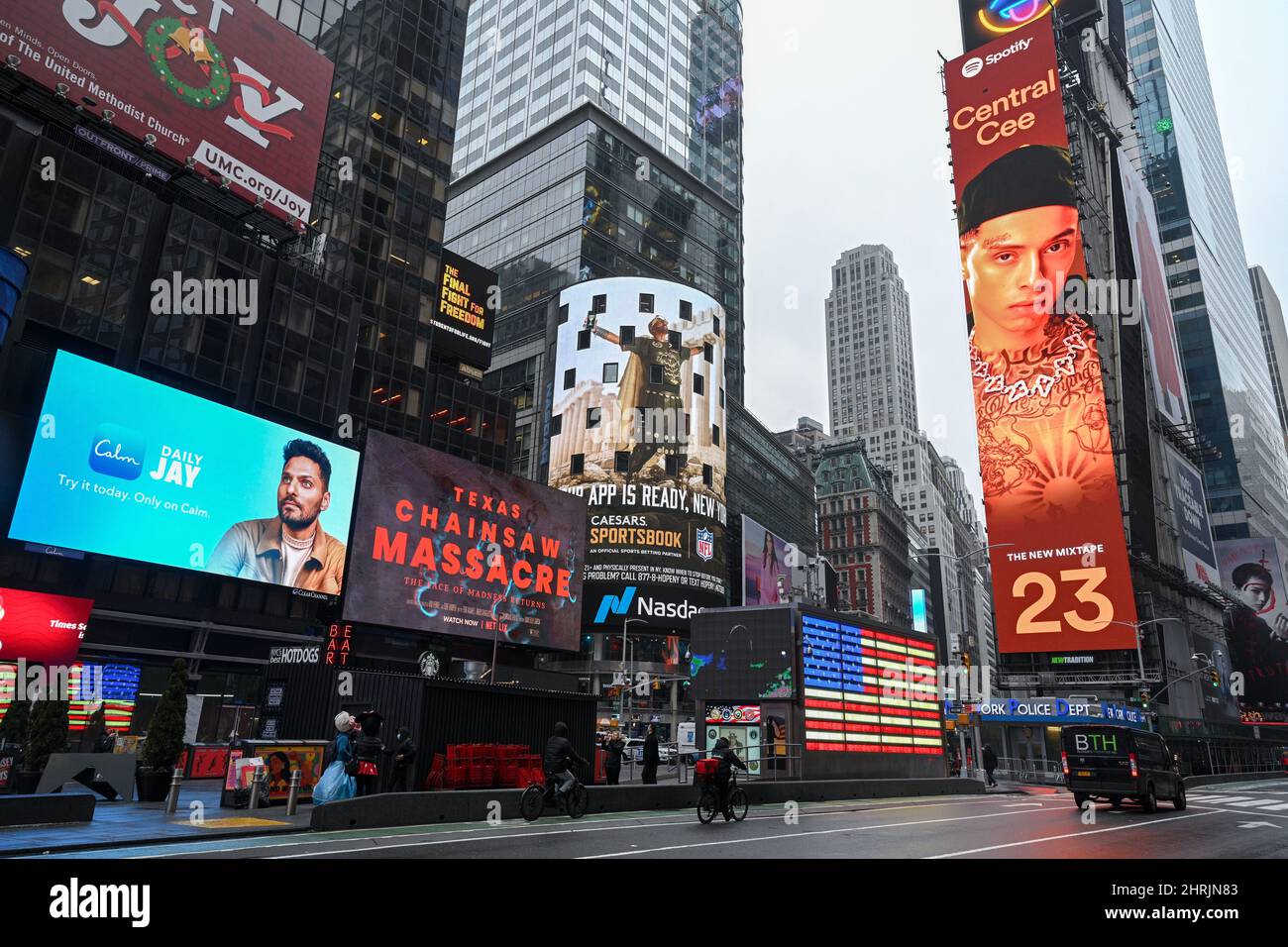 People walk in Times Square as cold weather causes icing on February 25 ...