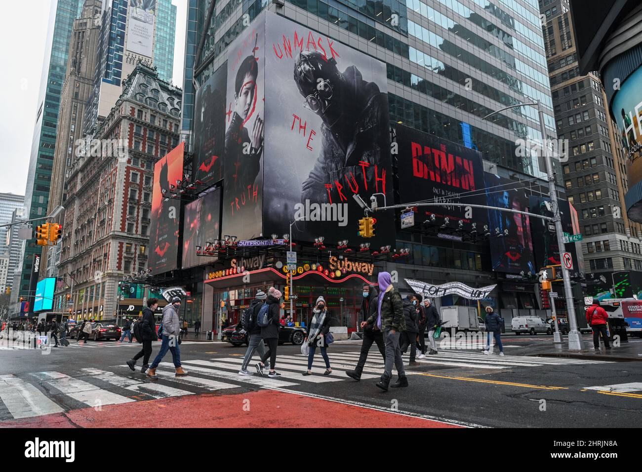 People walk a billboard for The Batman movie in Times Square on ...