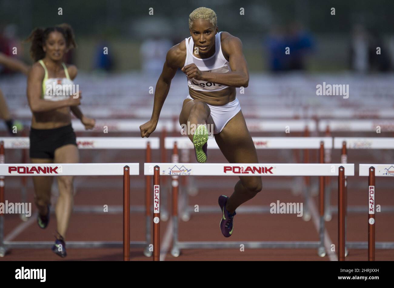 Phylicia George, of Canada, runs the 100 meter hurdles during the Harry ...