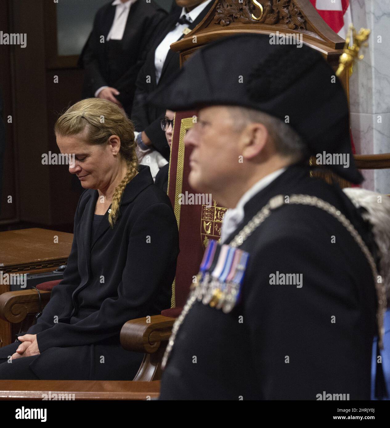 Usher of the Black Rod Greg Peters looks on as Governor General Julie ...