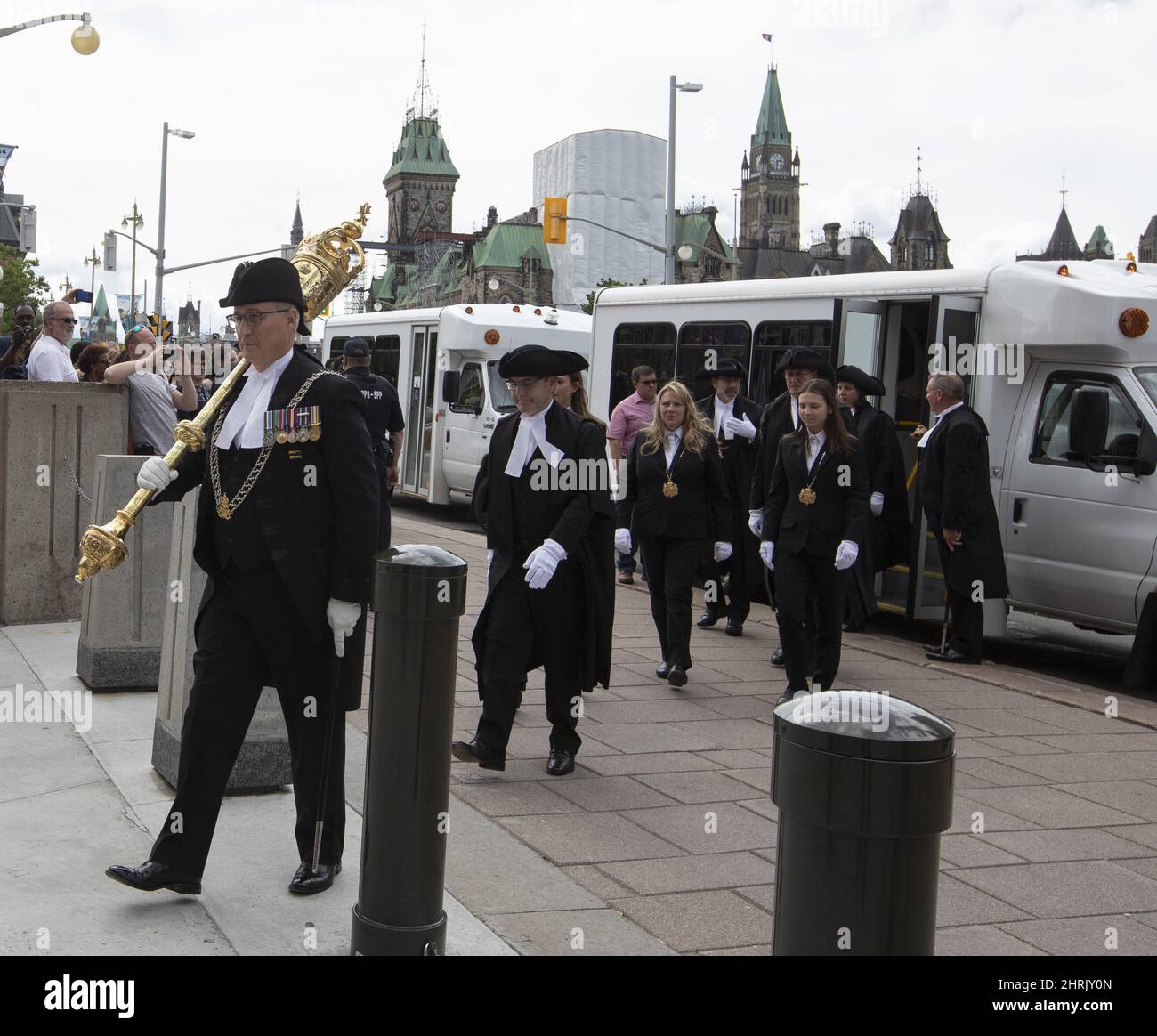 Sergeant-at-Arms Pat MacDonald leads members of parliament and other ...