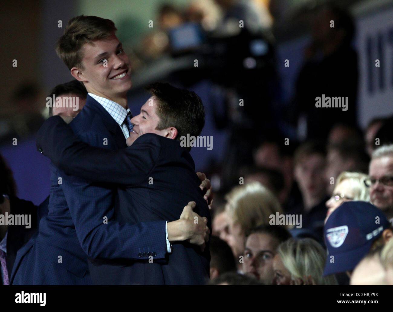Alex Vlasic, left, celebrates with family after being selected by the ...