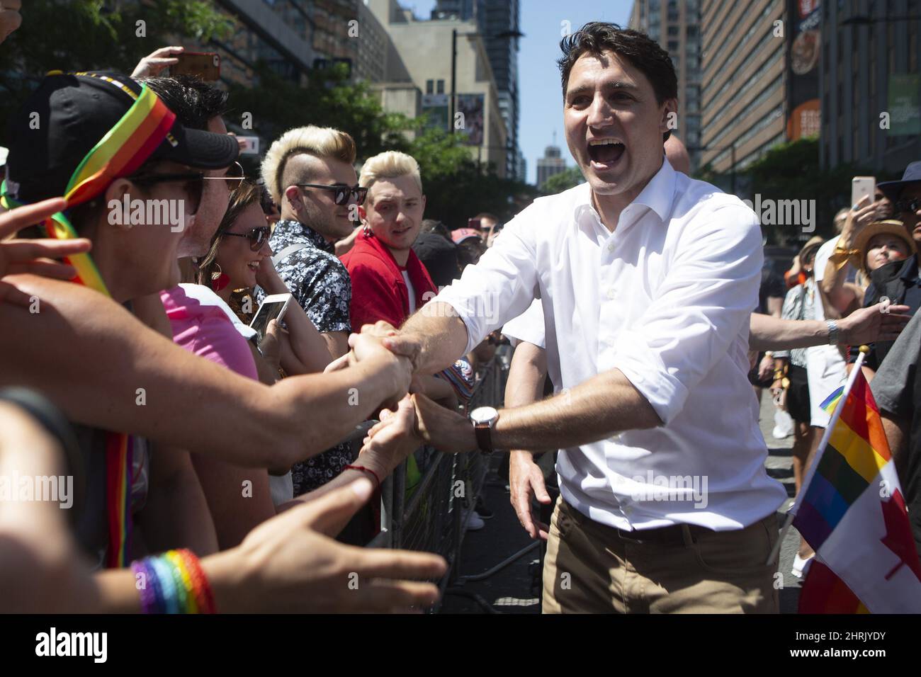 Prime Minister Justin Trudeau greets the crowd as he walks in Toronto's ...