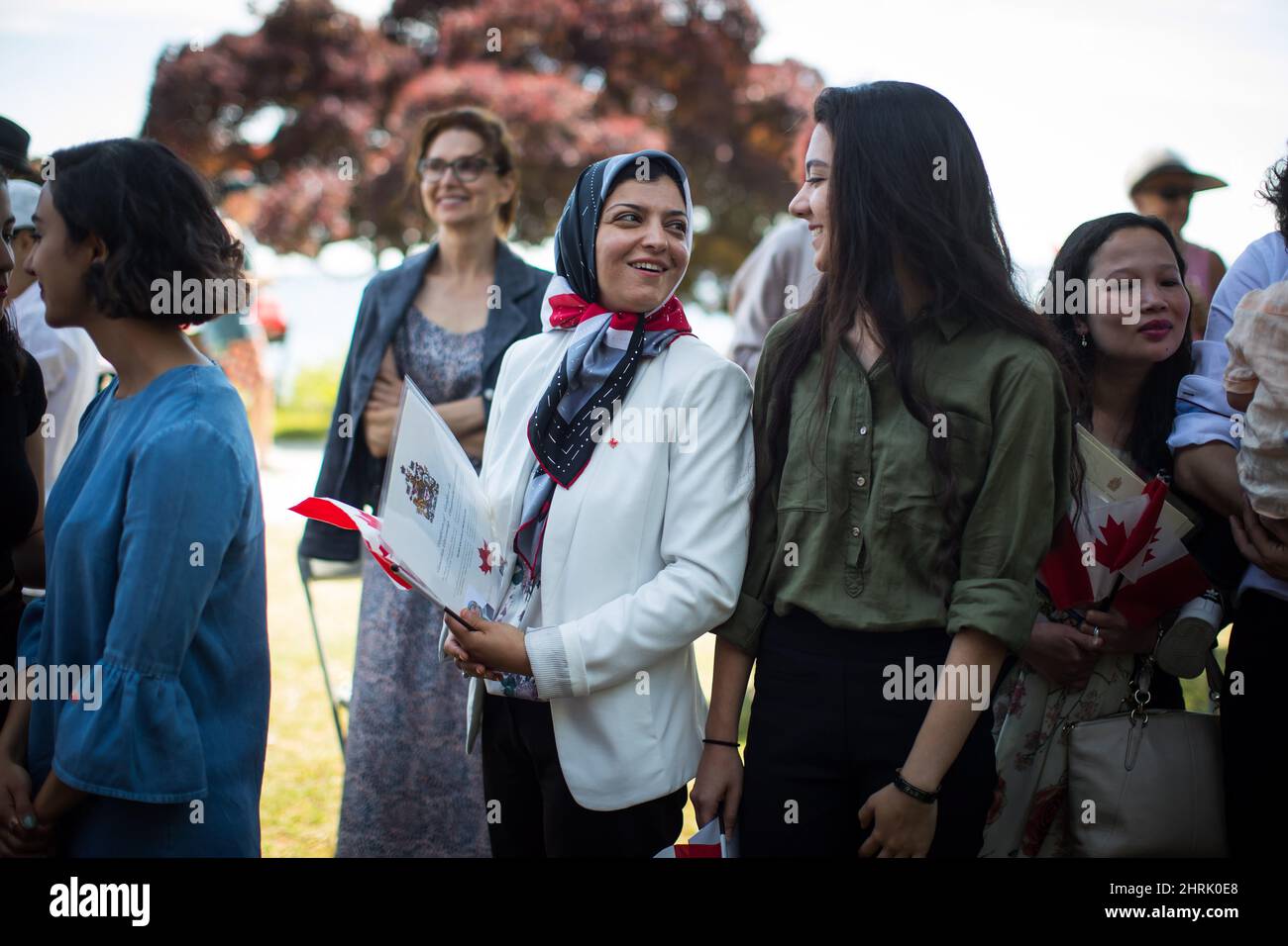 Maryam Sadat Montajabi, centre left, and her daughter Romina Khaksar ...