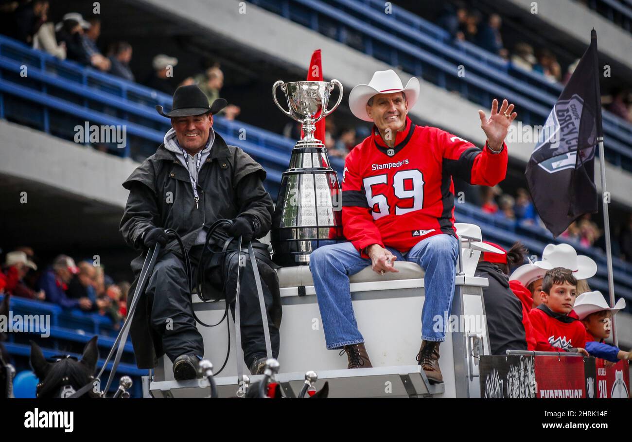Calgary Stampeder Grey Cup Champion, Rocco Romano, right, waves to the ...