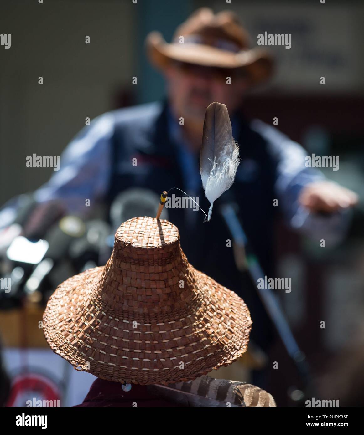An eagle feather attached to a hat worn by Kwikwetlem First Nation ...