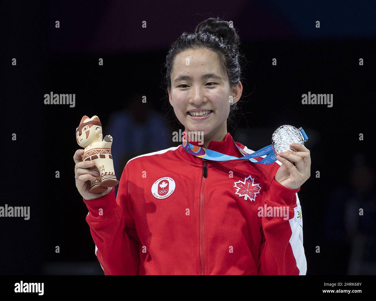 Canada's Jessica Guo displays her silver medal in the women's foil ...