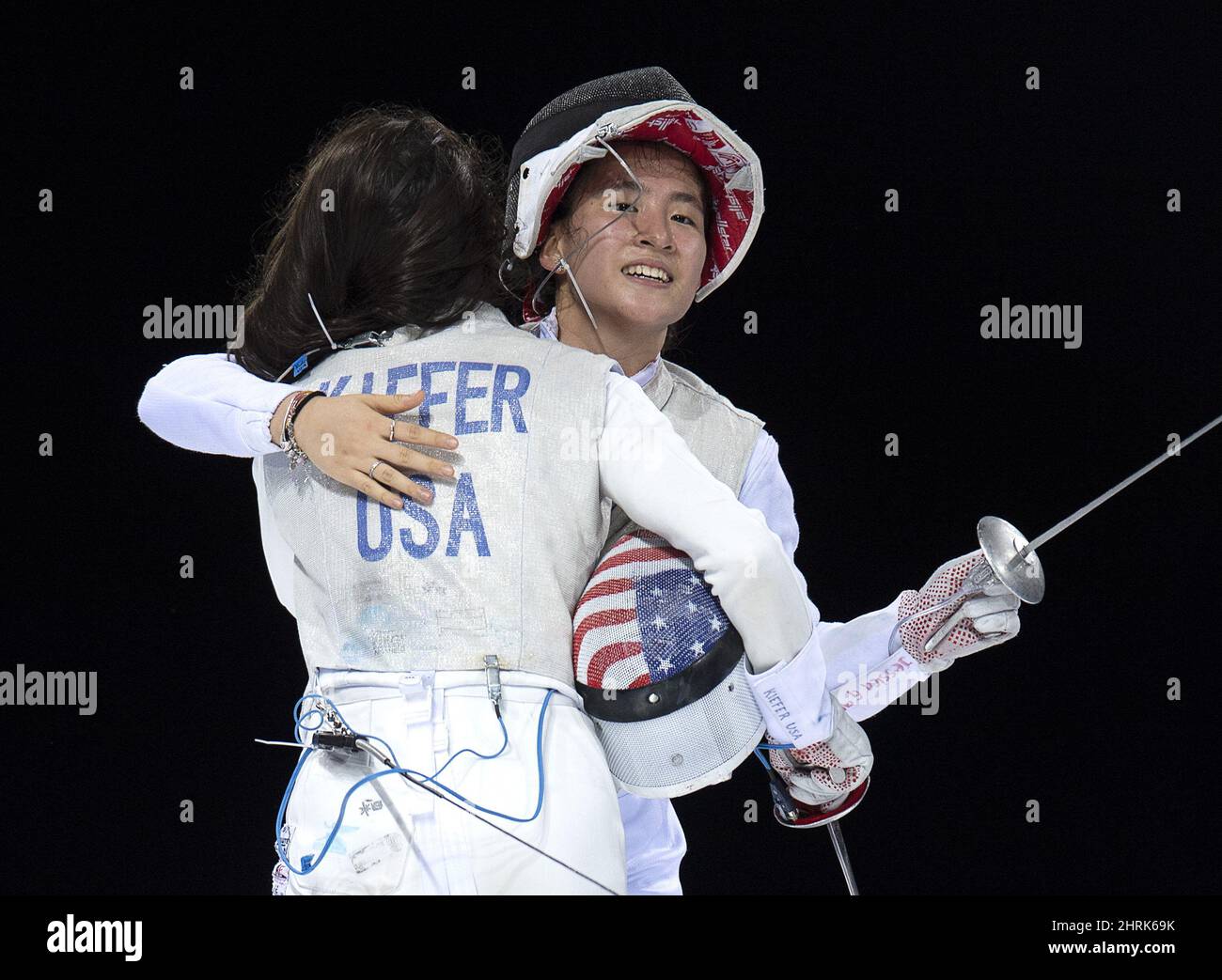Canada's Jessica Guo, right, congratulates USA's Lee Kiefer, gold ...
