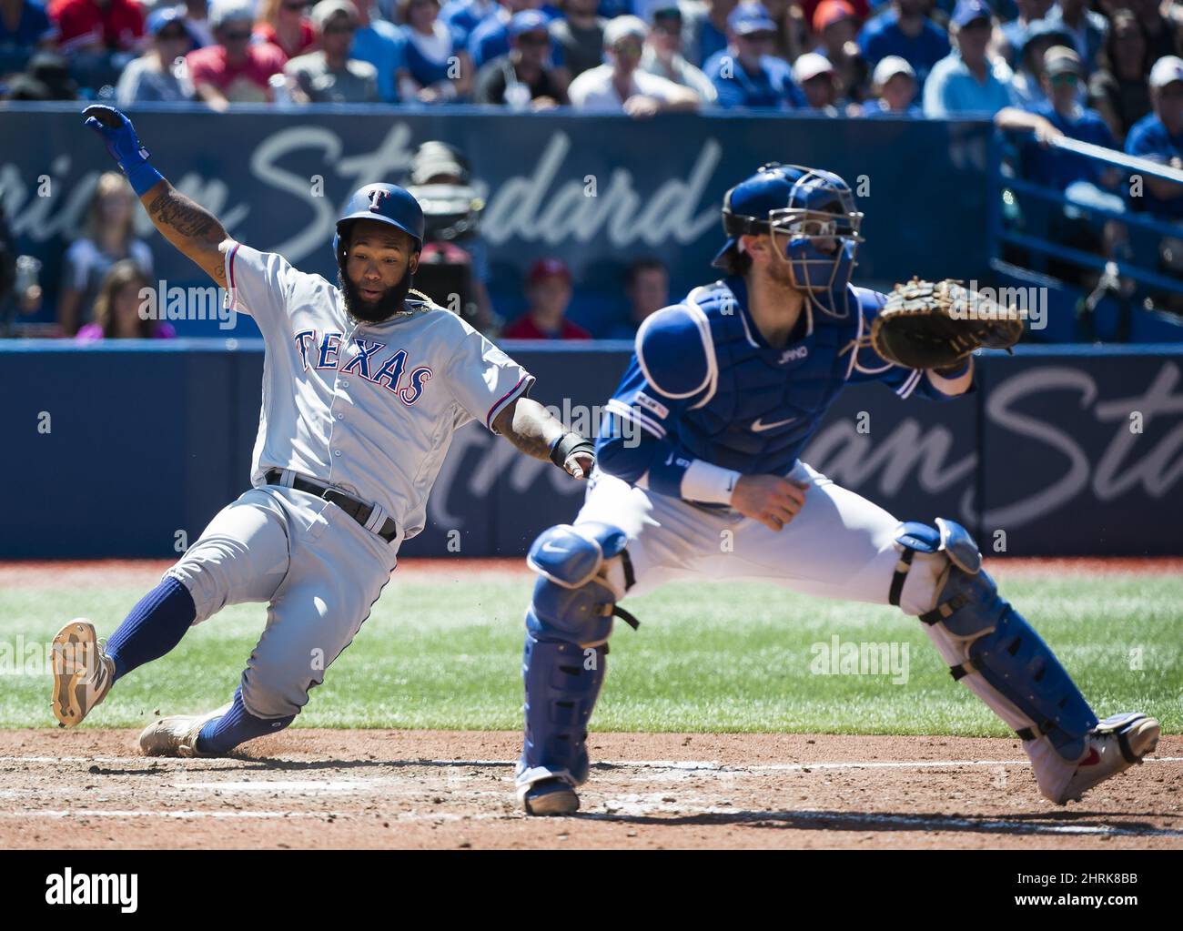 Texas Rangers first baseman Danny Santana (38) scores past Toronto Blue ...