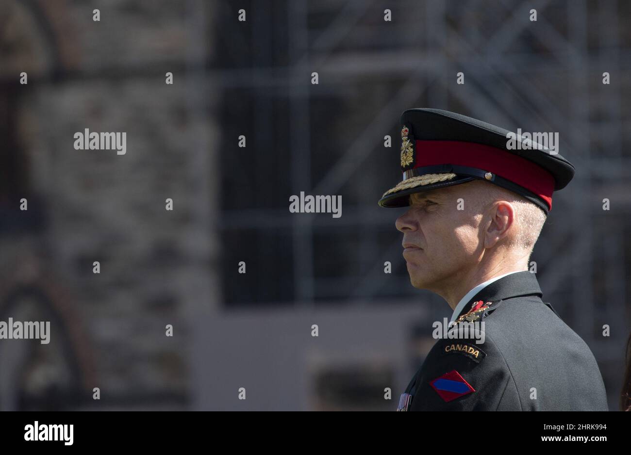 Lieutenant-General Wayne Eyre listens to speakers during a change of ...