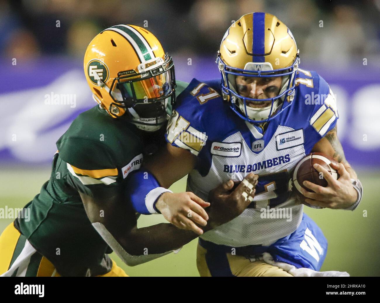 Winnipeg Blue Bombers quarterback Chris Streveler, right, runs the ball ...