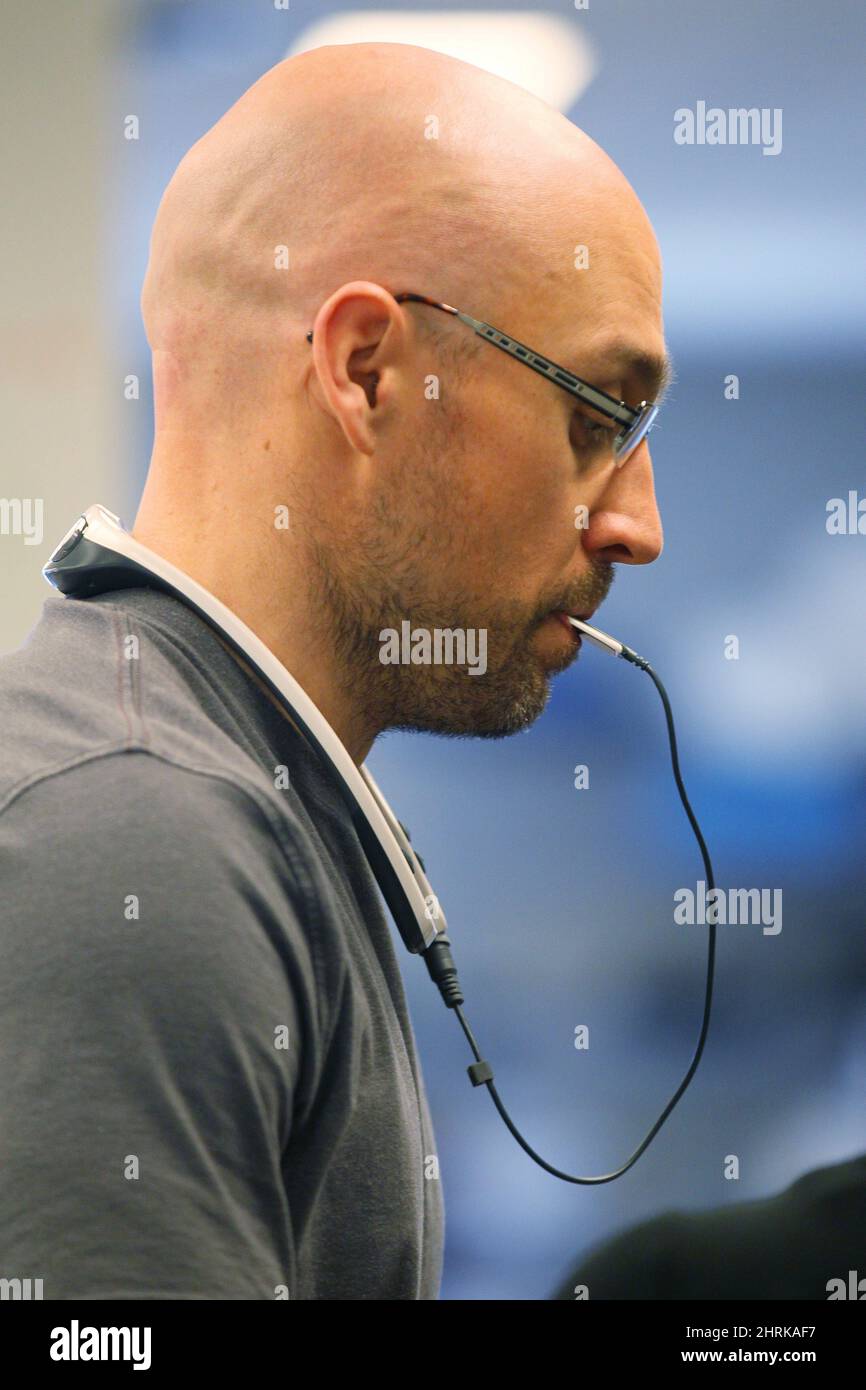 Patient Isaac Kohtakangas walks on a treadmill using the PoNS (Portable ...