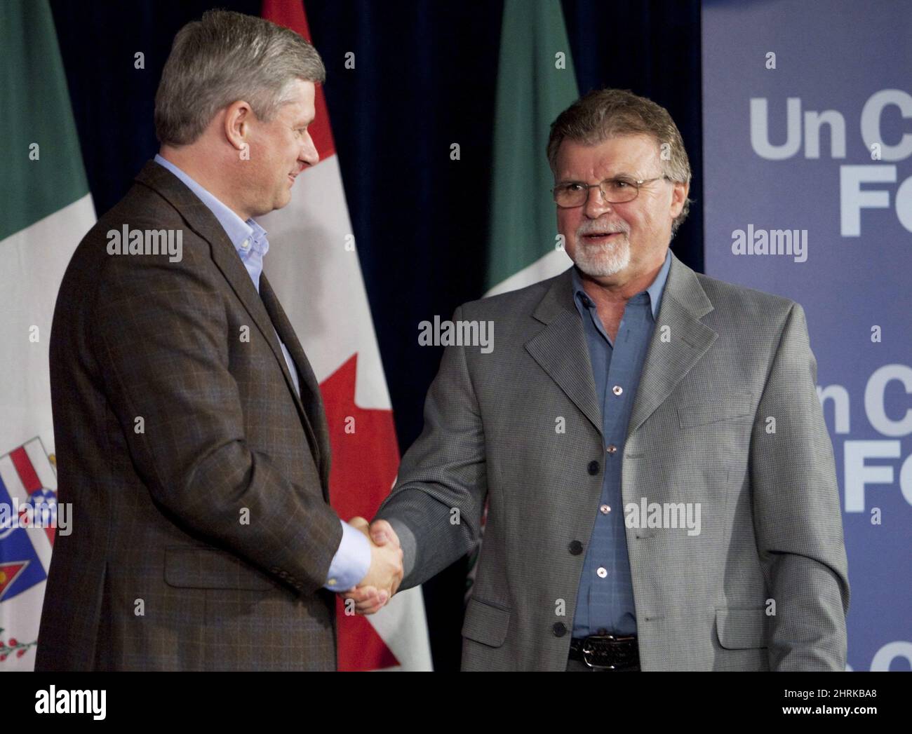 Prime Minister Stephen Harper shakes hands with Yukon Premier Dennis ...