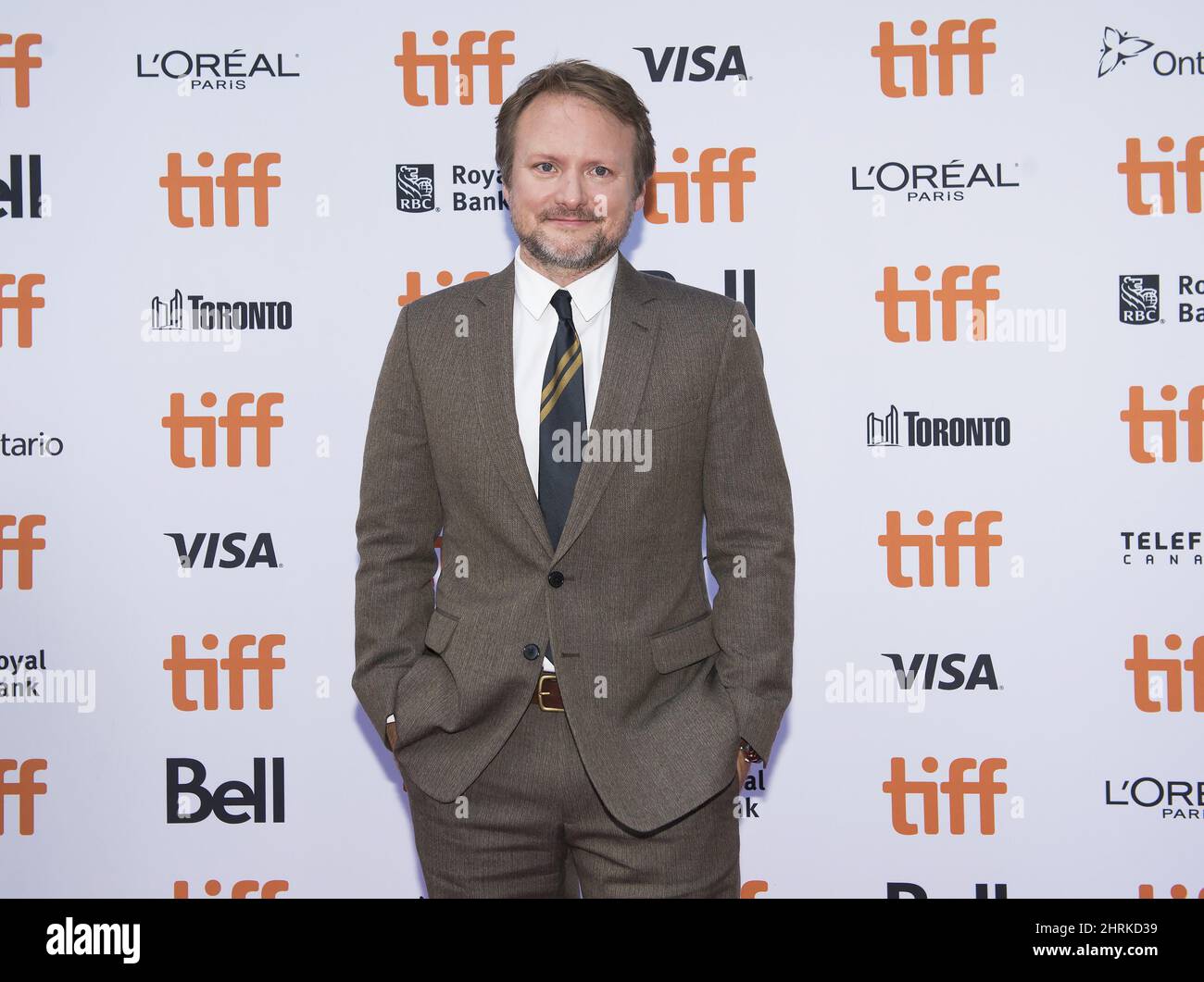 Director Rian Johnson poses for photographs on the red carpet for the ...