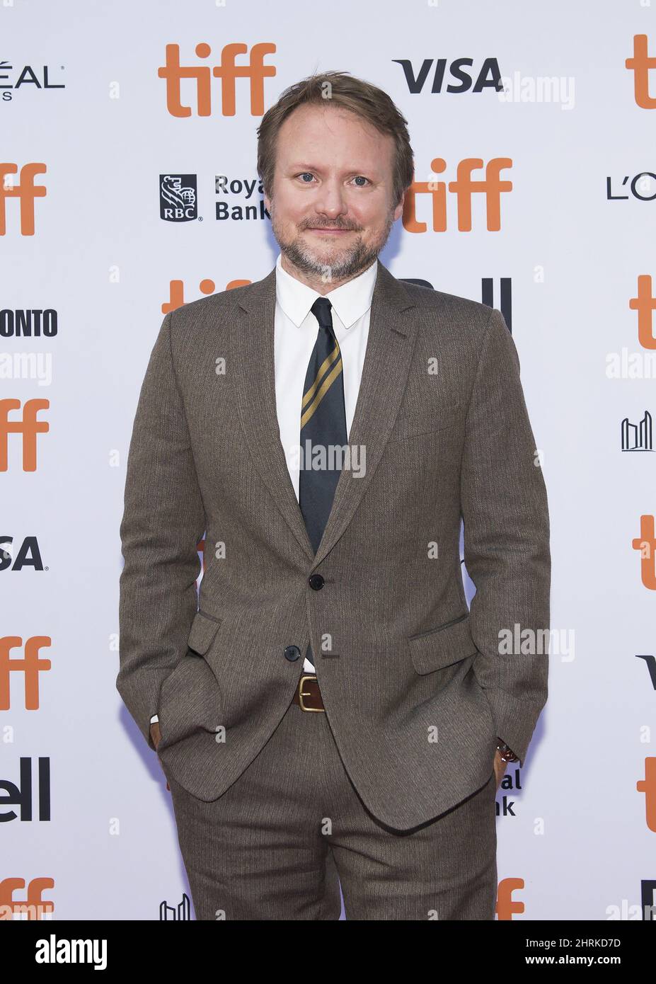 Director Rian Johnson poses for photographs on the red carpet for the ...