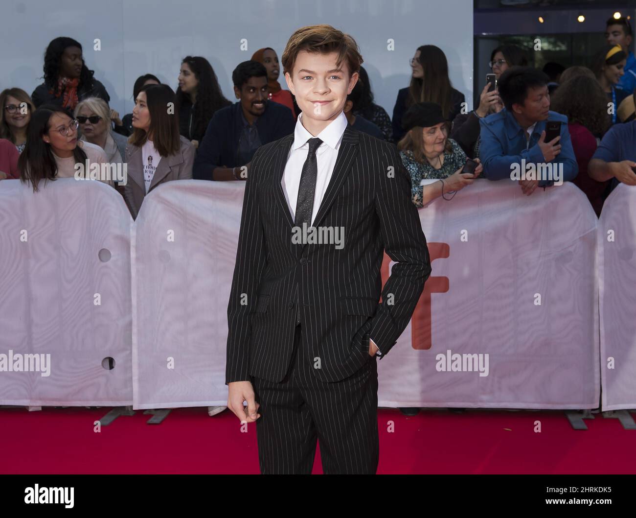 Actor Oakes Fegley arrives on the red carpet for the gala premiere of ...