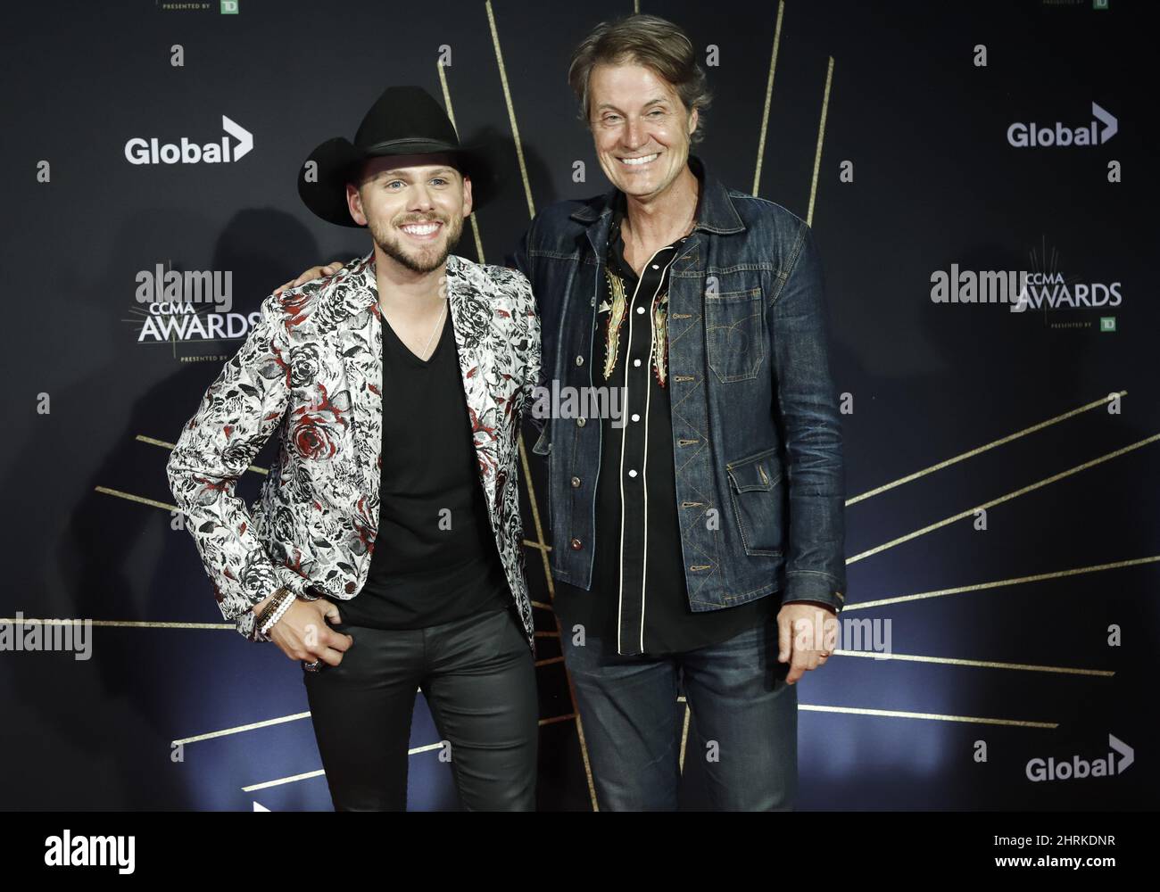 Jim Cuddy, right, and Brett Kissel pose on the red carpet at the ...