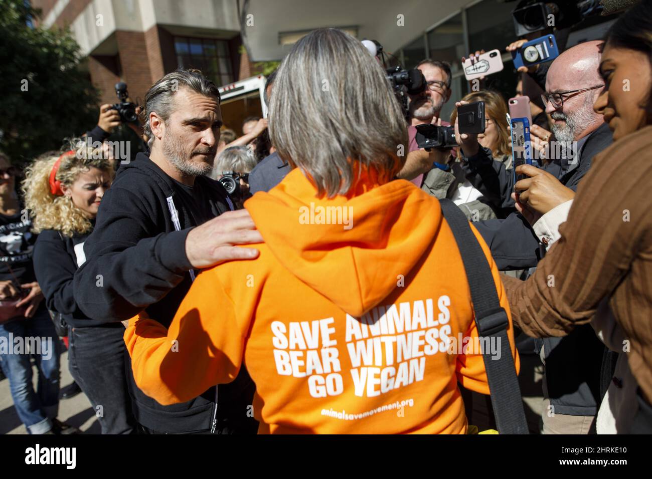 Actor Joaquin Phoenix embraces vegan activist Anita Krajnc after touring a vegan ad campaign ...