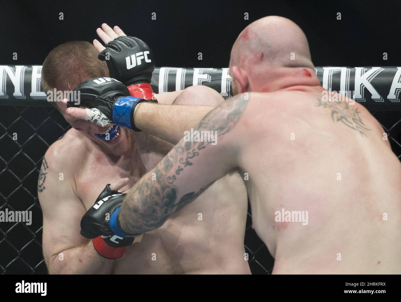 Todd Duffee, left, fights Jeff Hughes during their heavyweight match at ...