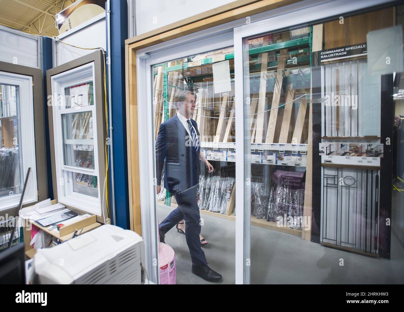 Federal Conservative leader Andrew Scheer is pictured through glass ...