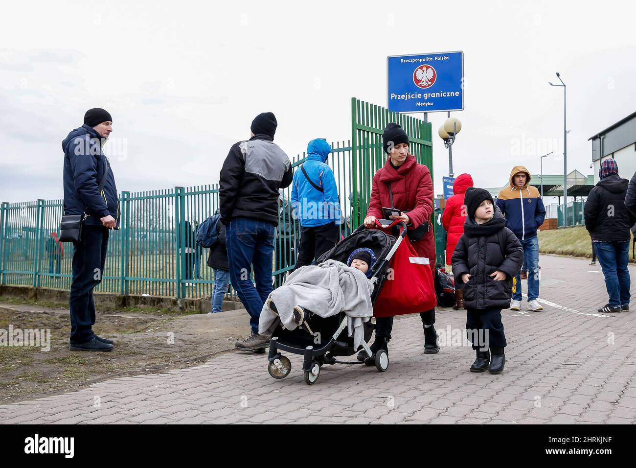 A Ukrainian family seen walking through the border crossing passage as ...